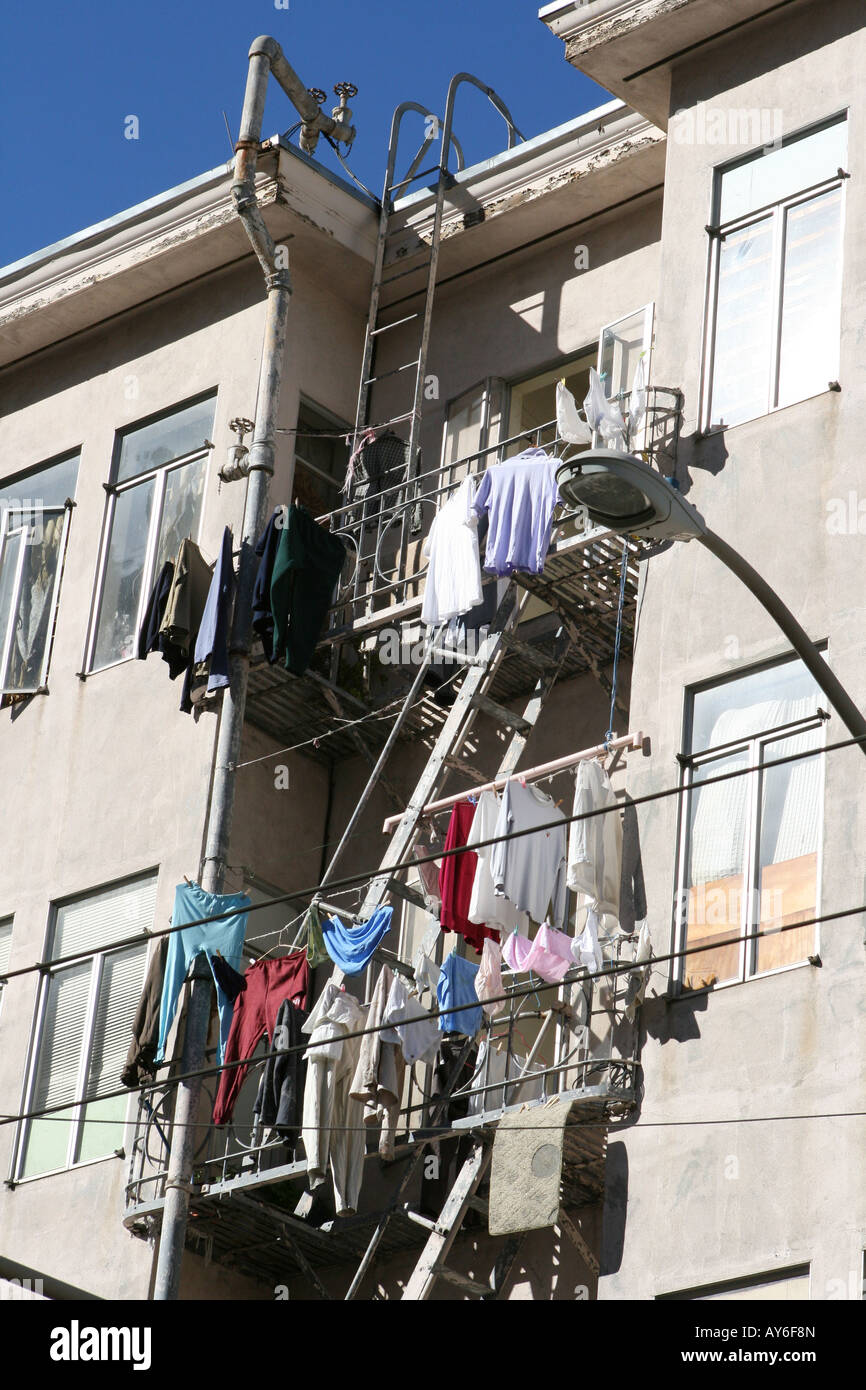 Laundry handing to dry on fire escape Stock Photo - Alamy