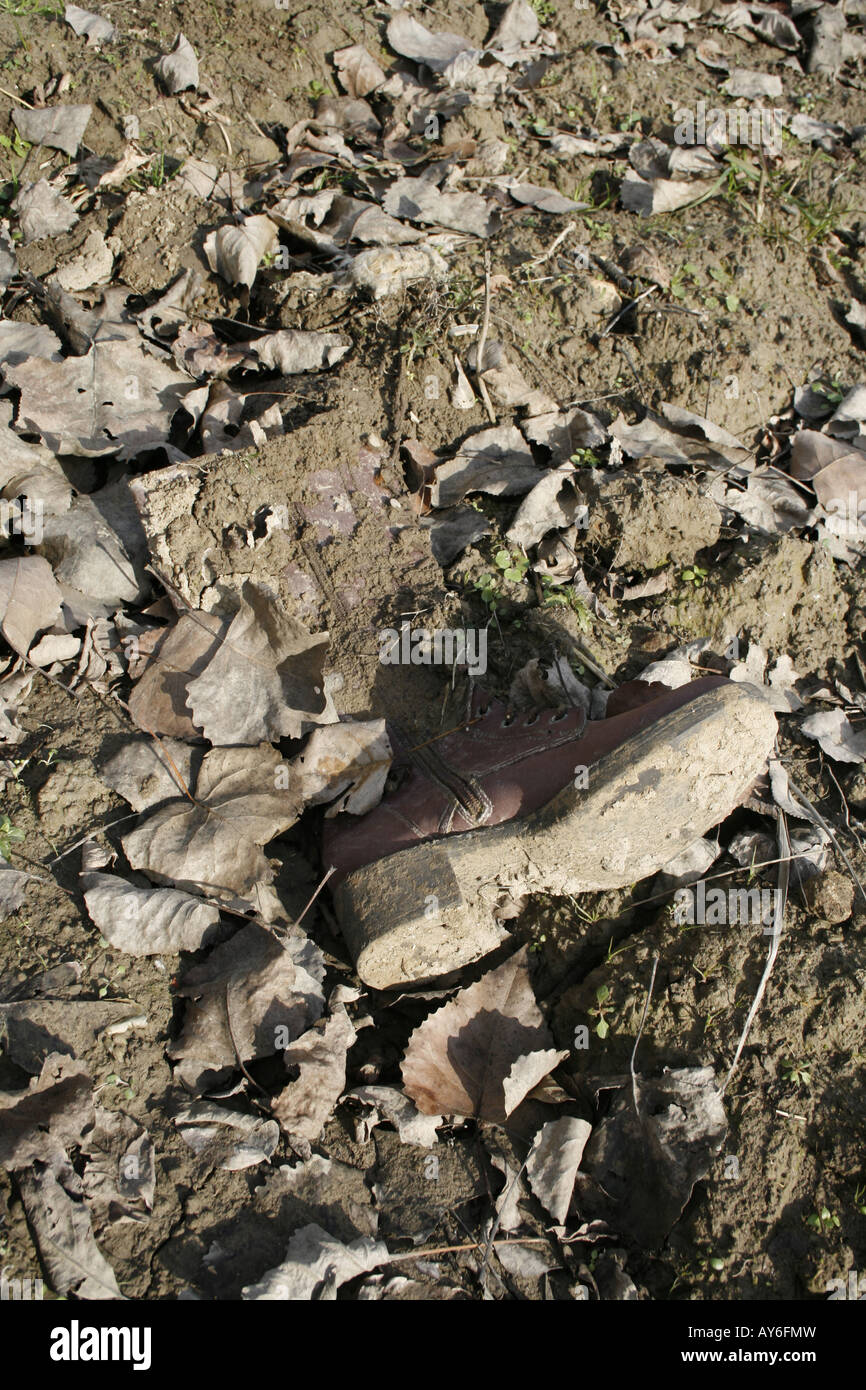 boot buried in field Stock Photo - Alamy