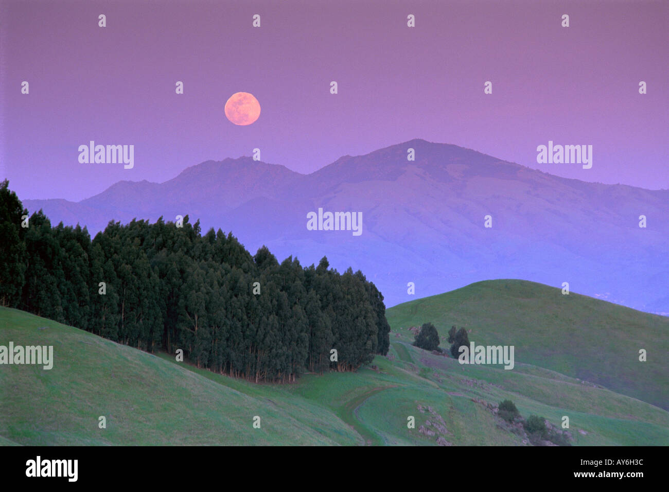 Full Moon over Mountain Stock Photo - Alamy