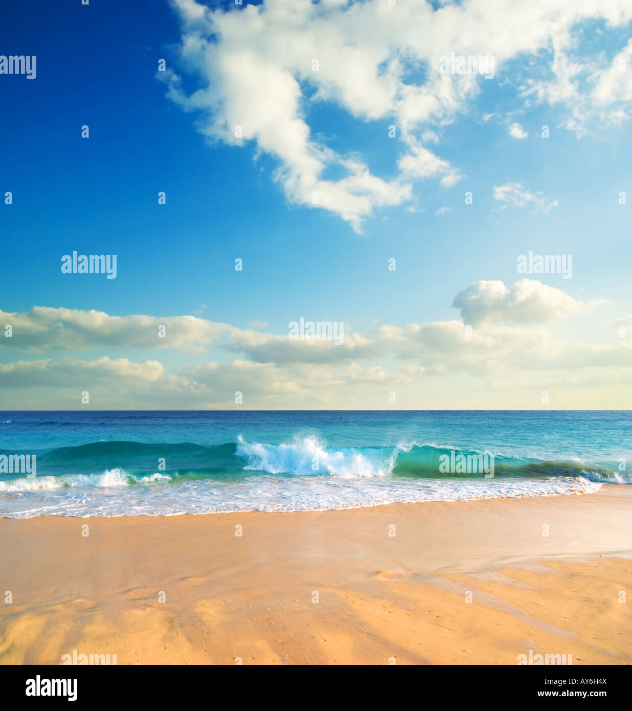 Photo of an empty beach with wave Stock Photo - Alamy