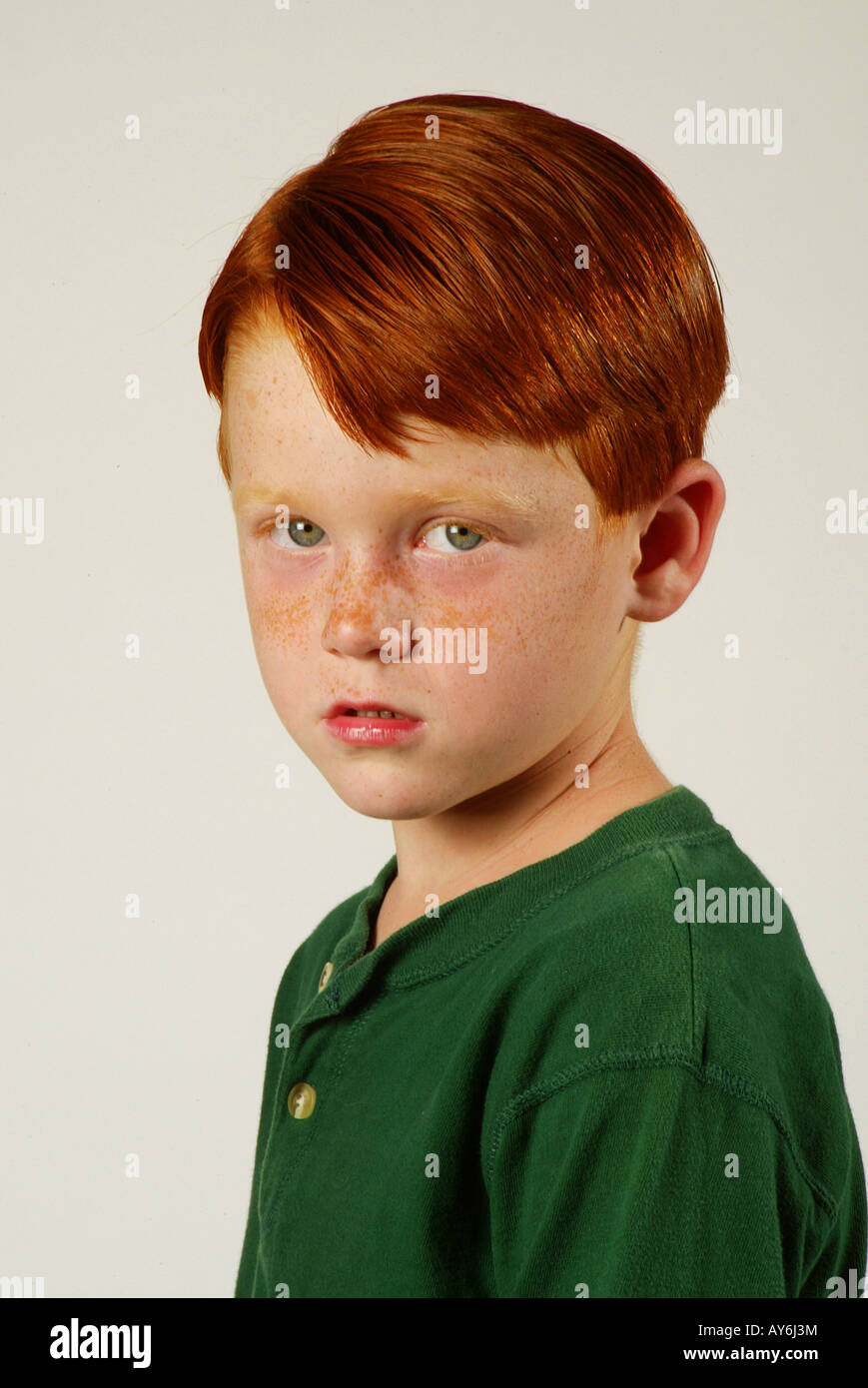 A 5 Year Old Red Headed Caucasian Boy In A Green Shirt From Southern