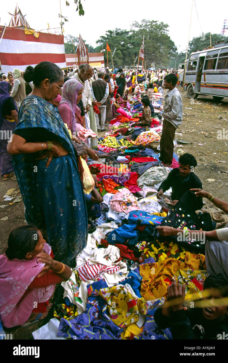 India West Bengal Calcutta Ganga Sagar Mela pilgrims at clothes stalls ...