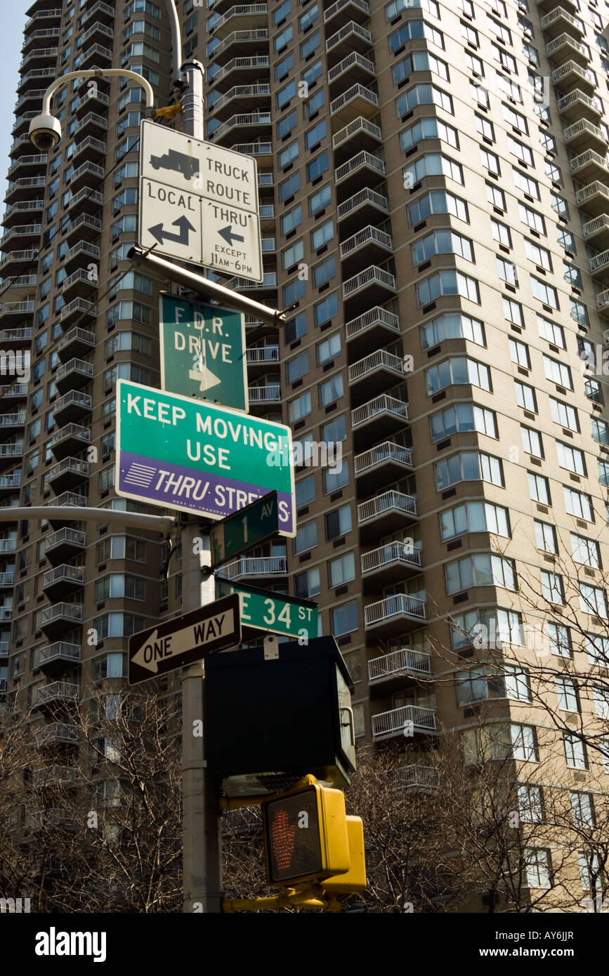 Lightpost with signs attached at the corner of 1st Avenue and 34th ...