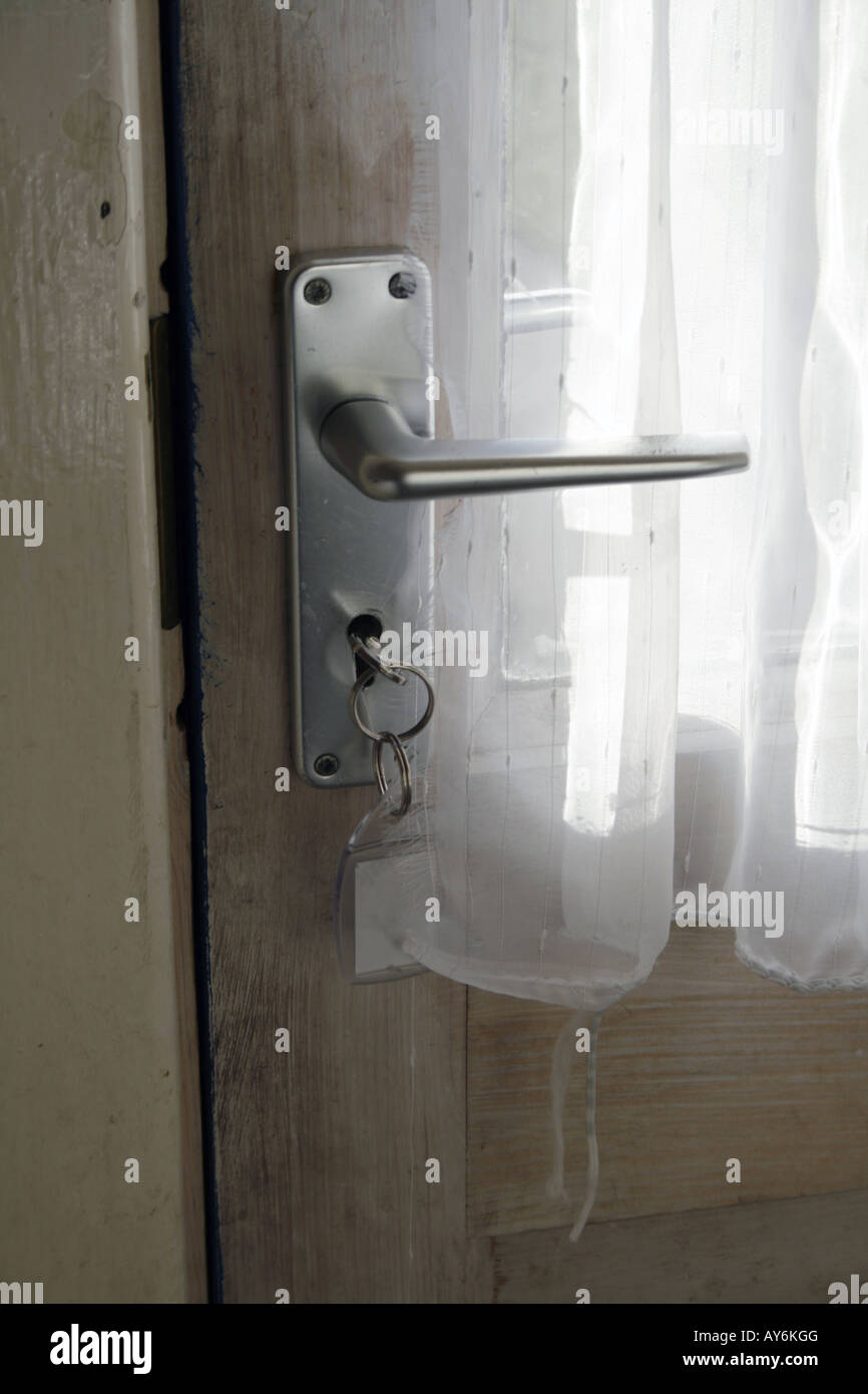 key in back door in home Stock Photo - Alamy