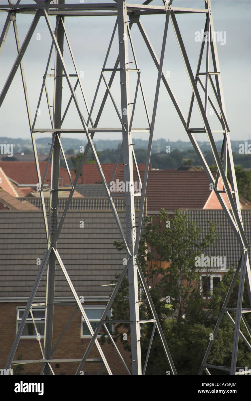 Electric pylons near homes Stock Photo - Alamy
