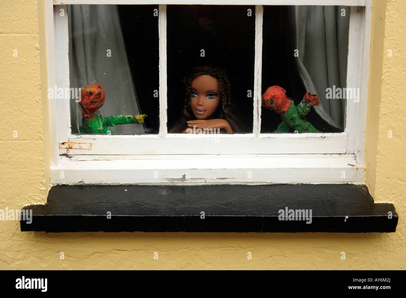 An odd display in a window in a house in West Sussex Stock Photo - Alamy
