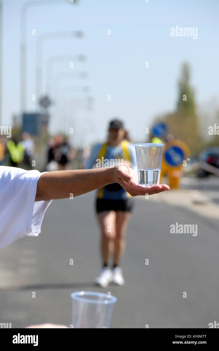 People Passing Out Cups of Water During A Marathon Stock Photo - Alamy