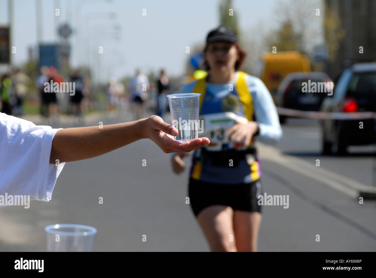 People Passing Out Cups of Water During A Marathon Stock Photo - Alamy