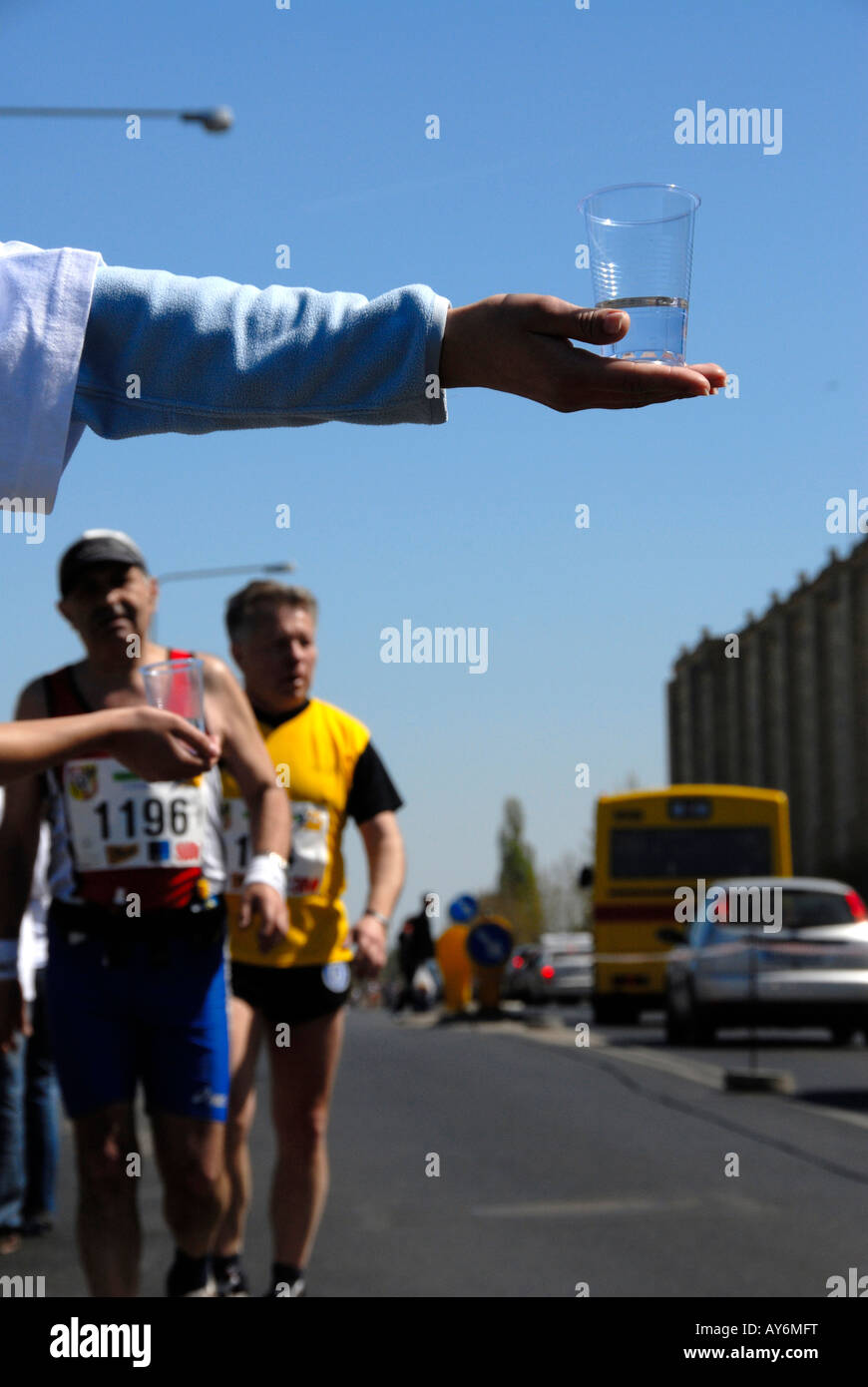 People Passing Out Cups of Water During A Marathon Stock Photo - Alamy