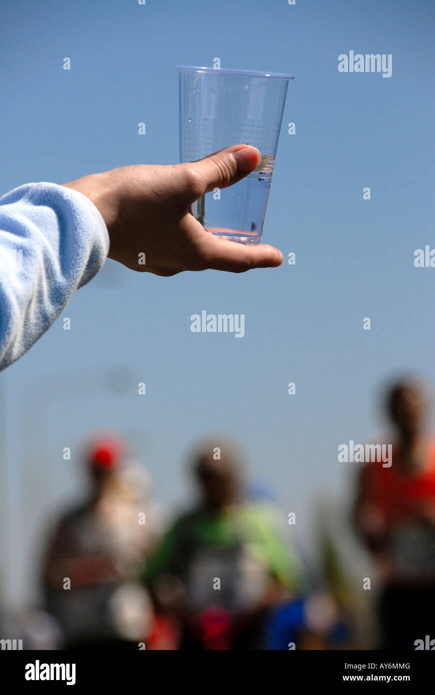 People Passing Out Cups of Water During A Marathon Stock Photo - Alamy