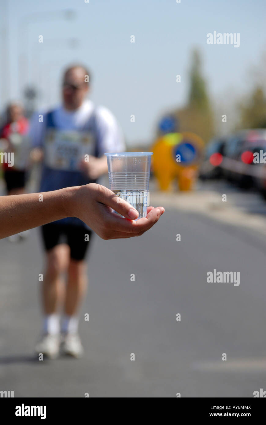 People Passing Out Cups of Water During A Marathon Stock Photo - Alamy