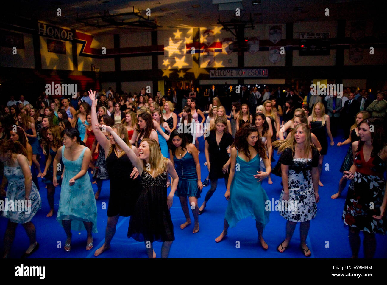 Teen girls get a mass dance lesson before dancing with their fathers at ...