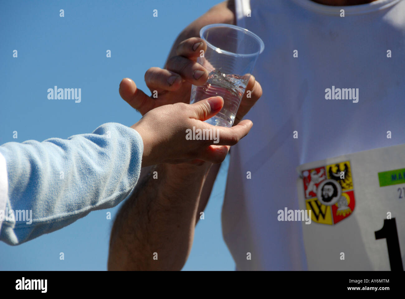 People Passing Out Cups of Water During A Marathon Stock Photo - Alamy