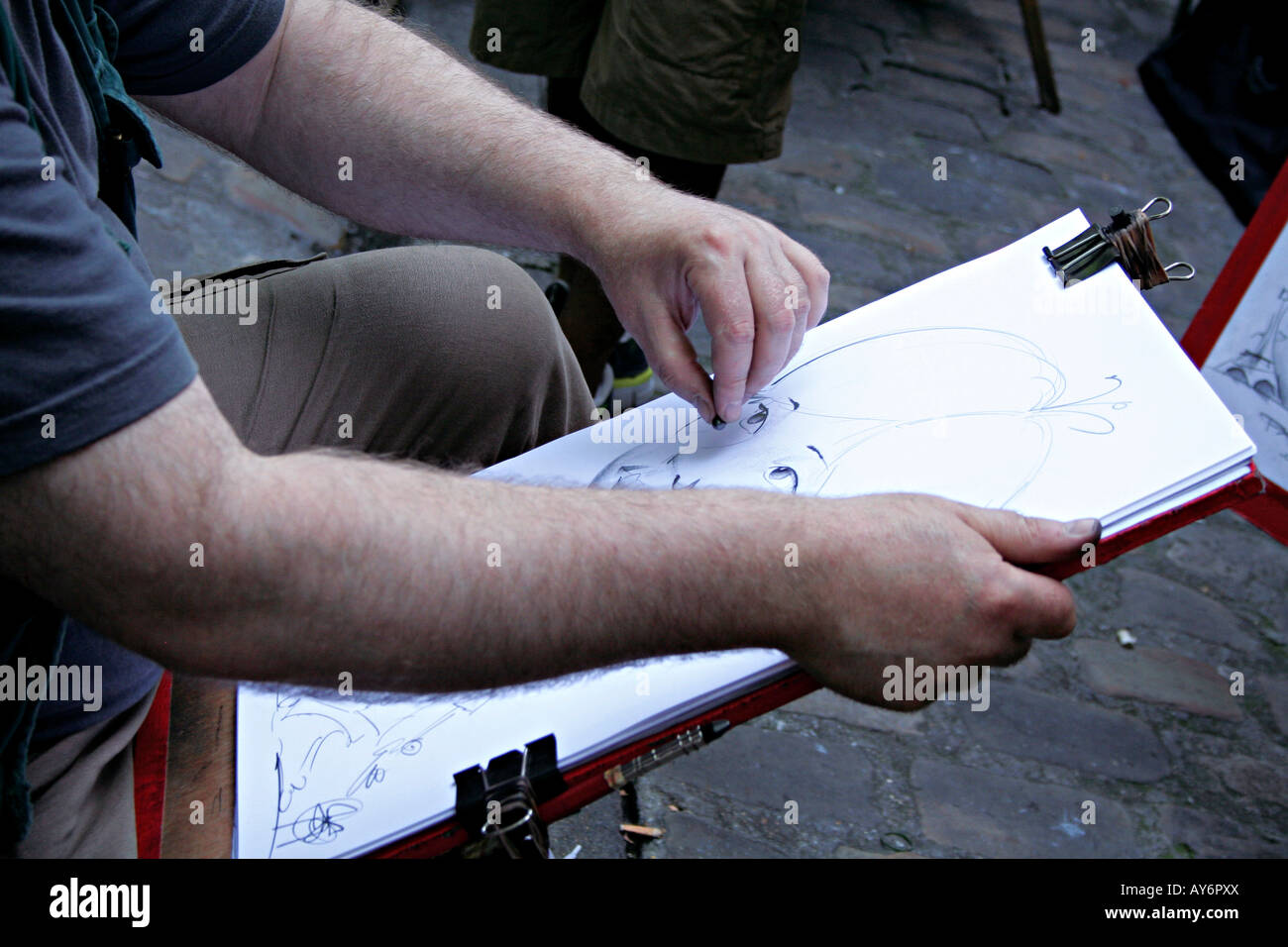 Street artist painting a portrait Stock Photo - Alamy