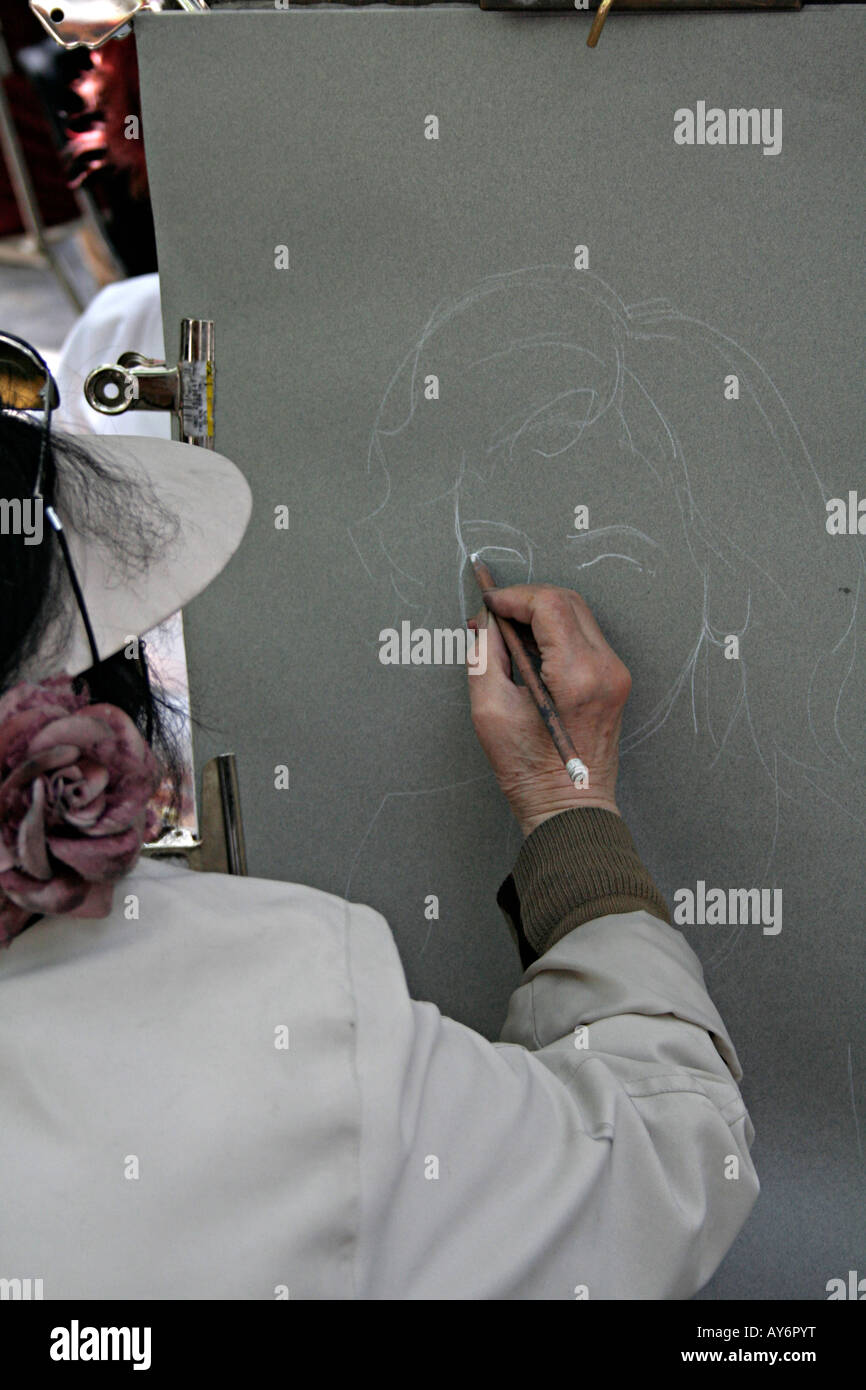 Street artist painting a portrait Stock Photo - Alamy