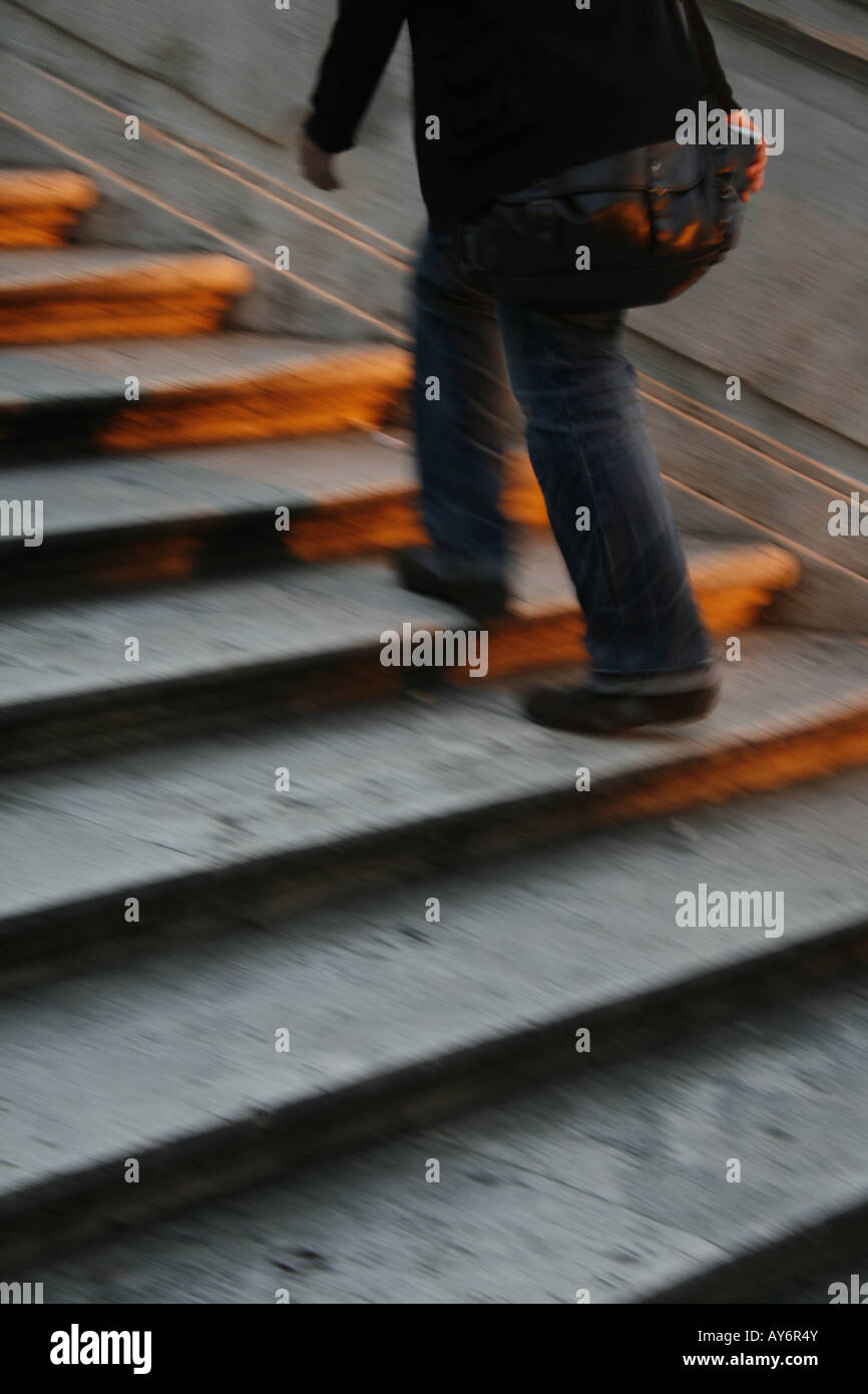 one person walking in street in city town Stock Photo - Alamy