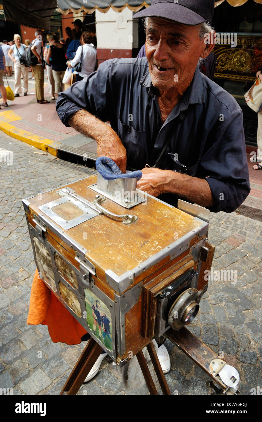 Photographer developing film in his old wood box camera, neighbourhood ...