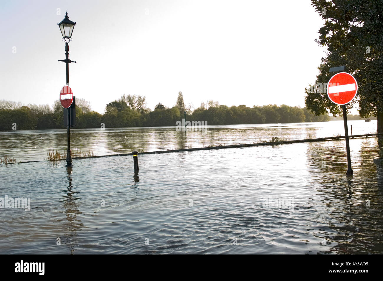 Spring tide floods road two no entery signs one on a lamp post Stock ...