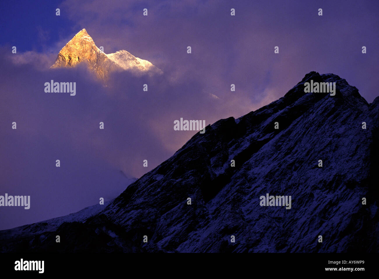 A sunlit Machhapuchhare Fishtail Mountain and clouds taken from ...