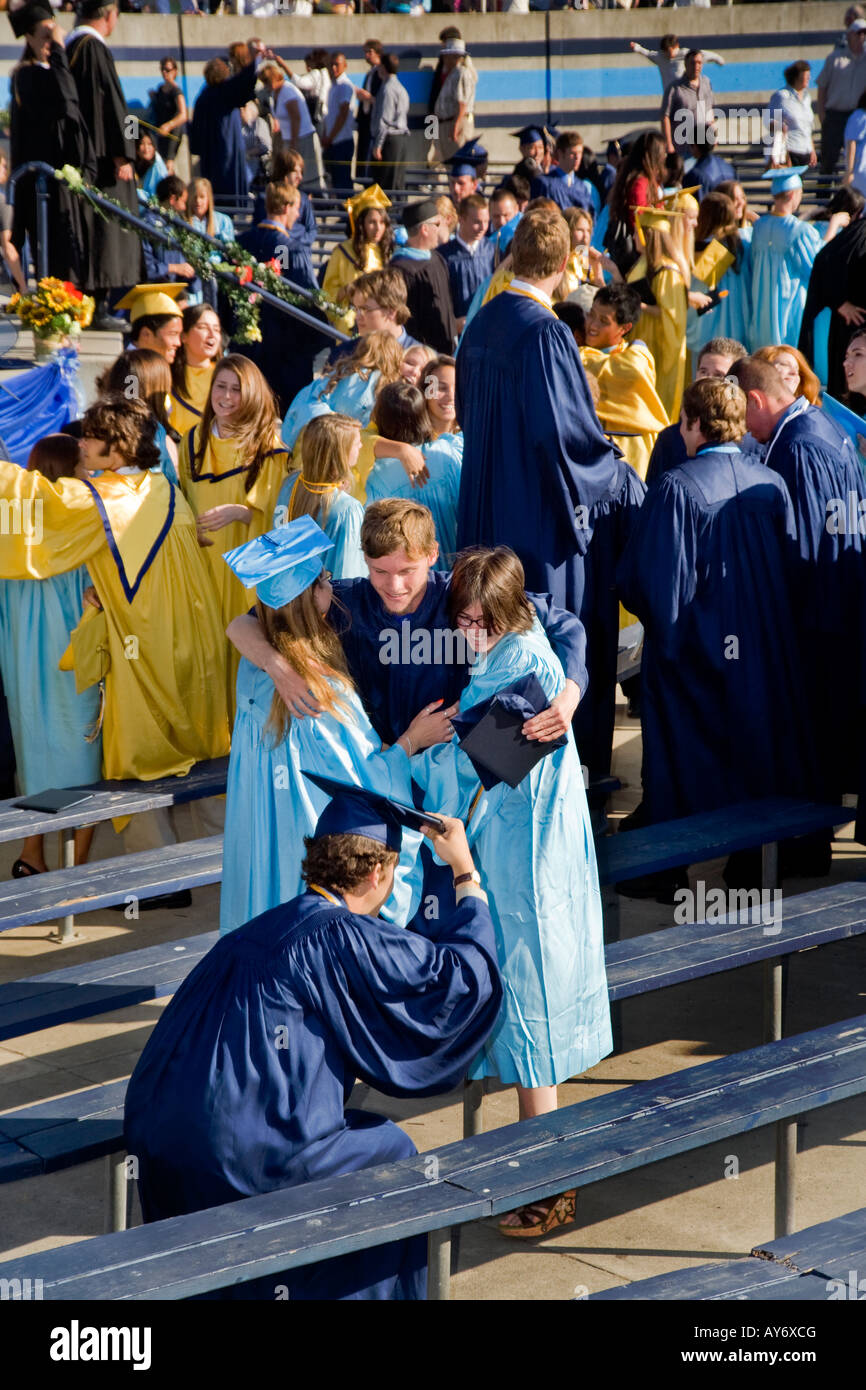 Graduating high school seniors hug after commencement Stock Photo - Alamy