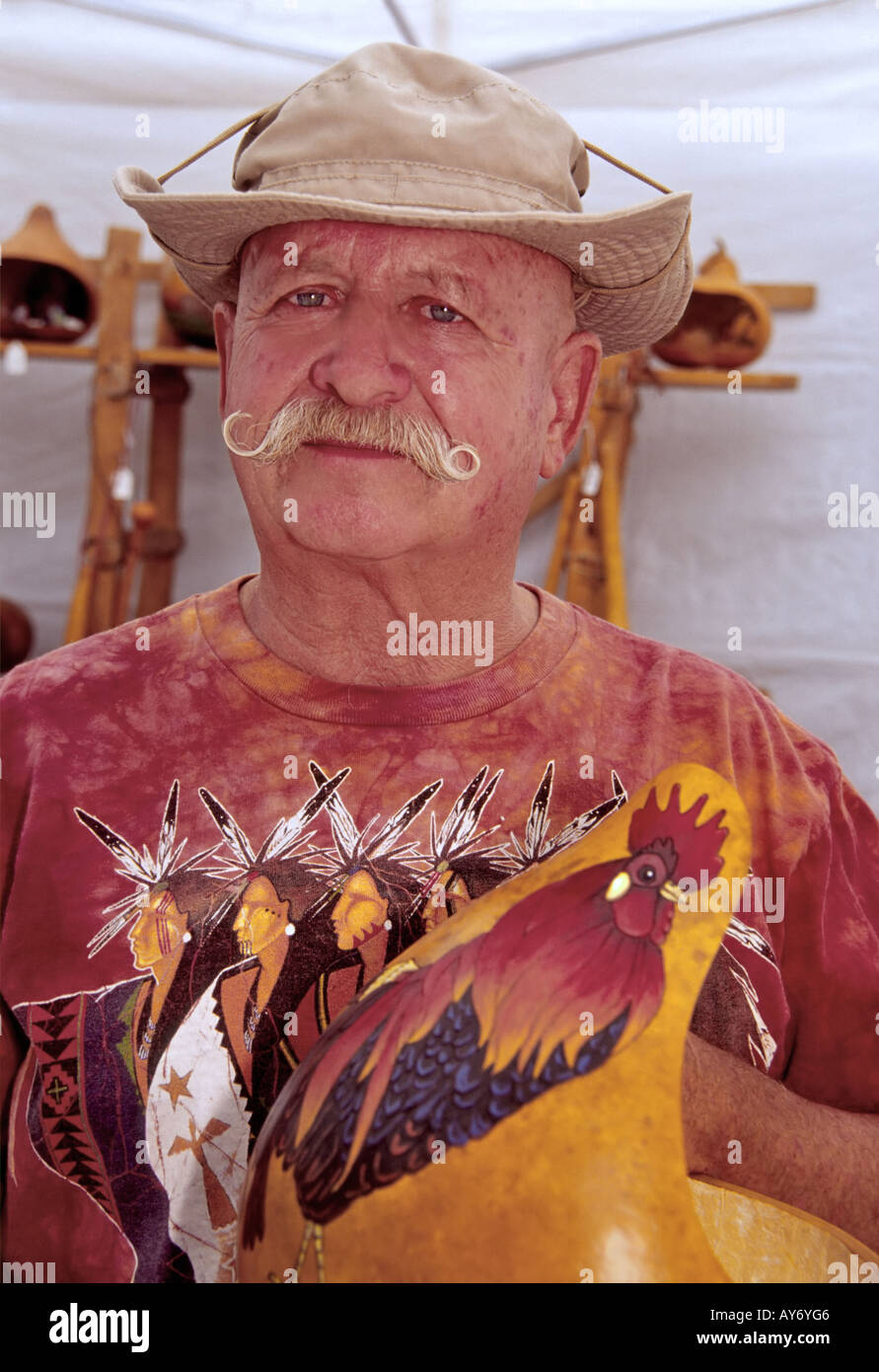 MR 558 Gourd artist Robert Fern displays a rooster creation, at the ...