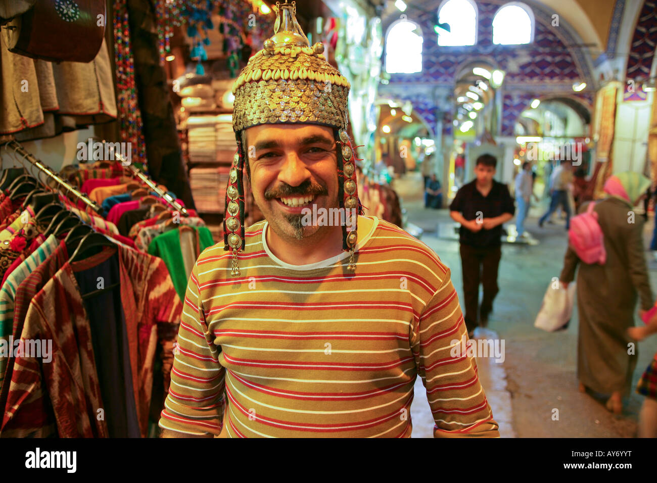 Man in striped t shirt wearing ethnic hat for fun Grand Bazaar Istanbul ...