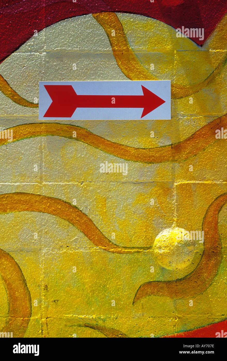 Red arrow on wall Stock Photo - Alamy