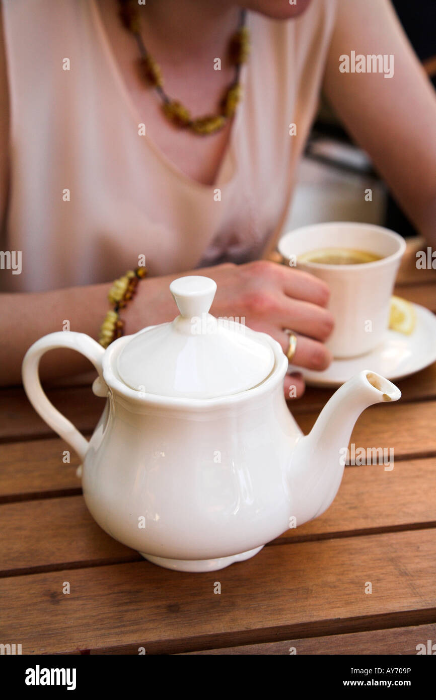 Tea pot and tea cup on a wooden table outdoor Stock Photo - Alamy