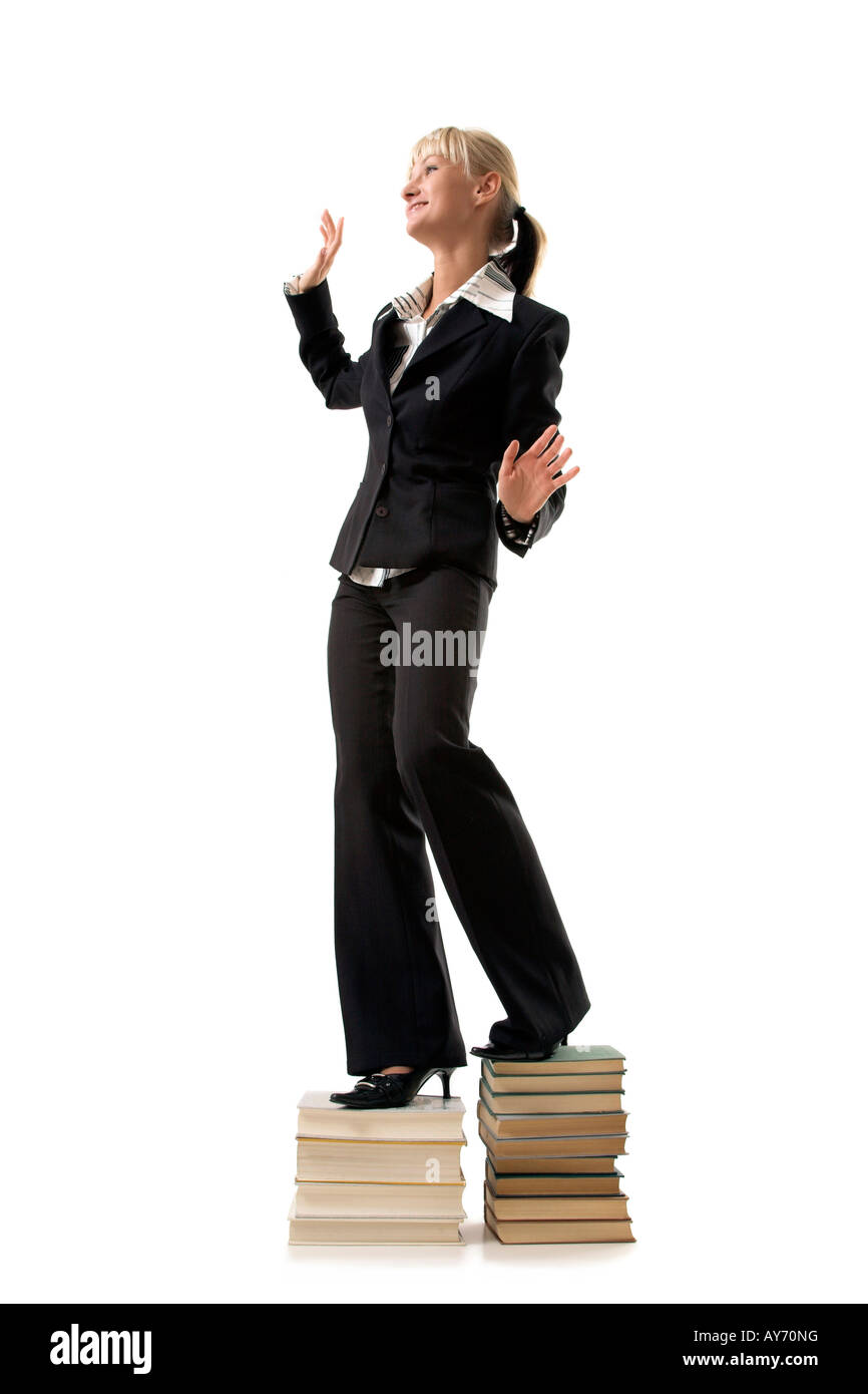 Smiling woman reaching book hi-res stock photography and images - Alamy