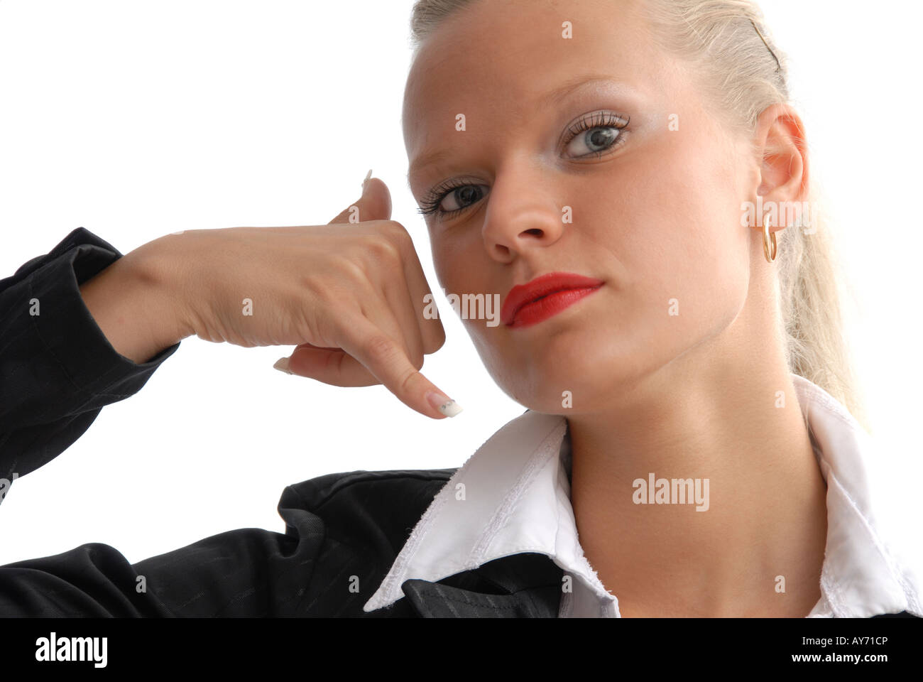 Young woman gesturing with three middle fingers folded against palm ...