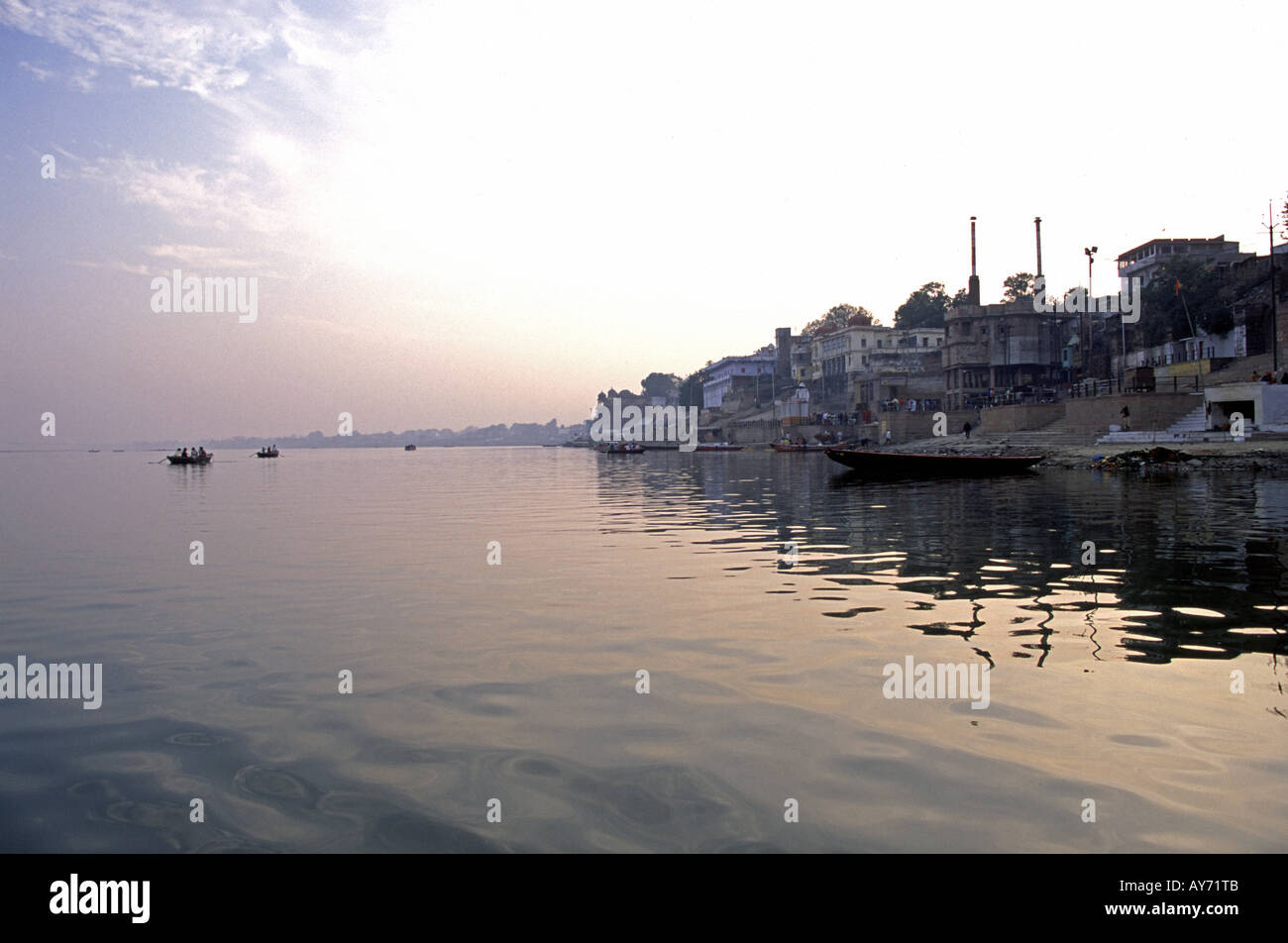 Reflection of Varanasi in the sacred River Ganges Uttar Pradesh state ...