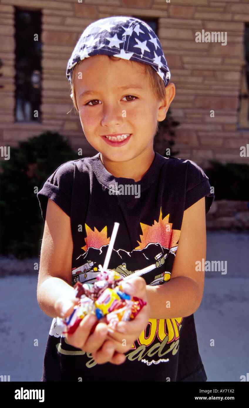 MR 693 Andy Osorio displays candy acquired at the ZOZO Street Fair in ...