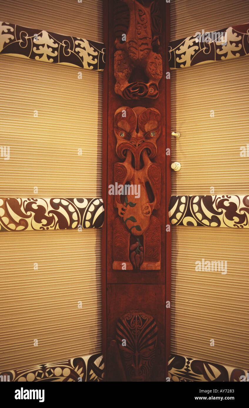 Maori carvings and designs on supporting roof beam in Auckland ...