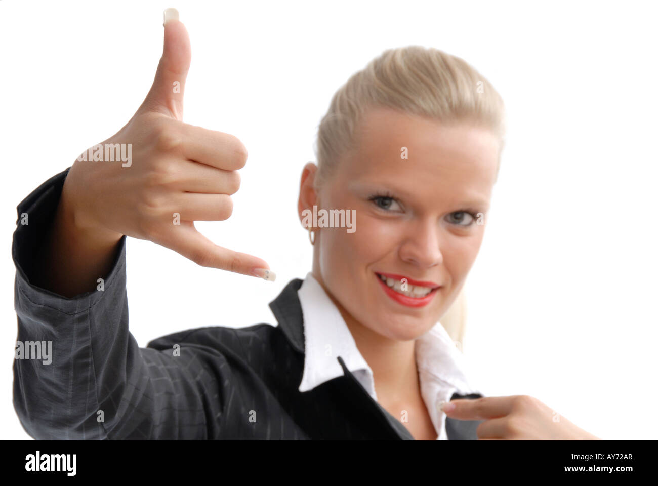 Young woman gesturing with three middle fingers folded against palm ...