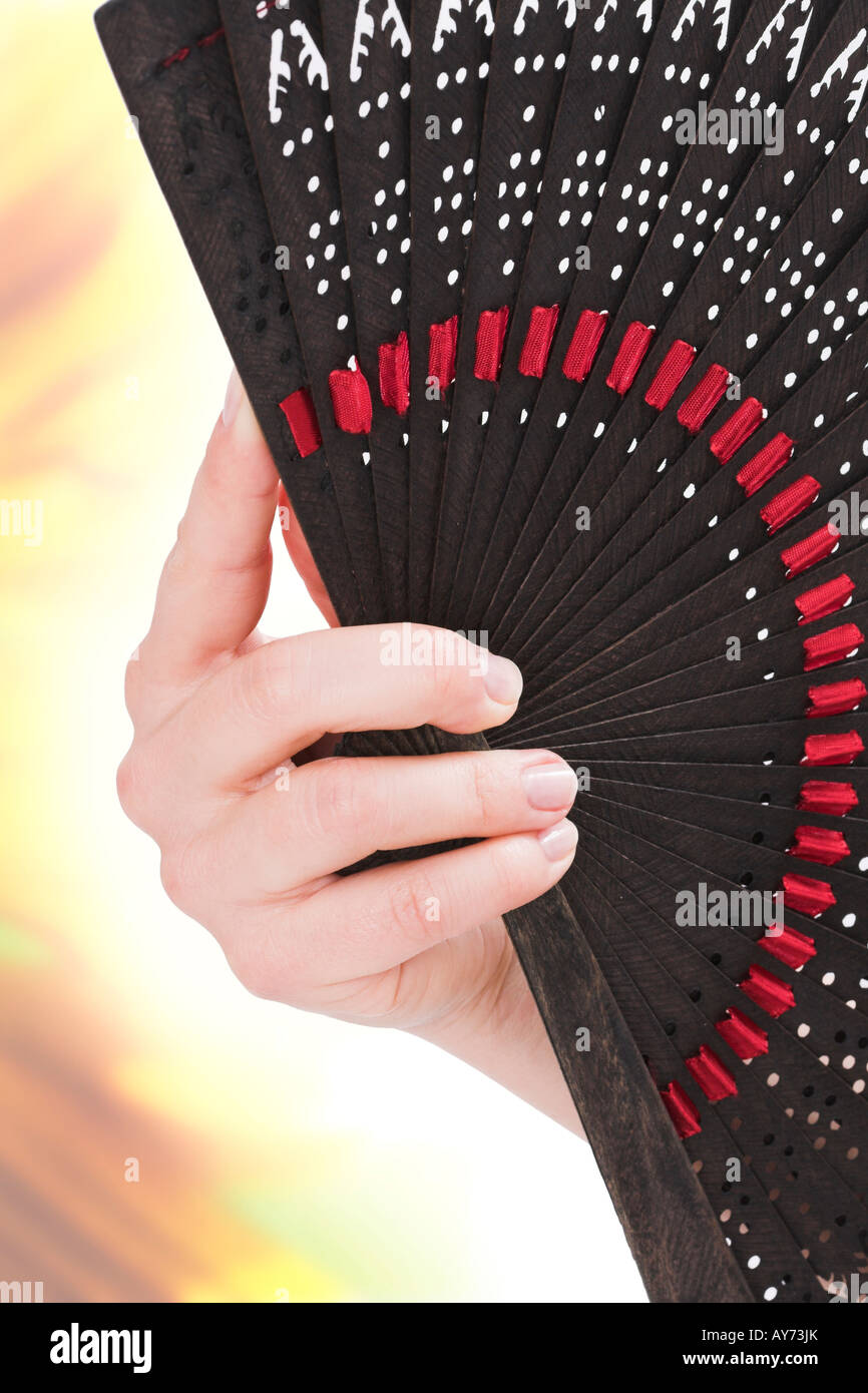Womans Hand with Fan Stock Photo - Alamy