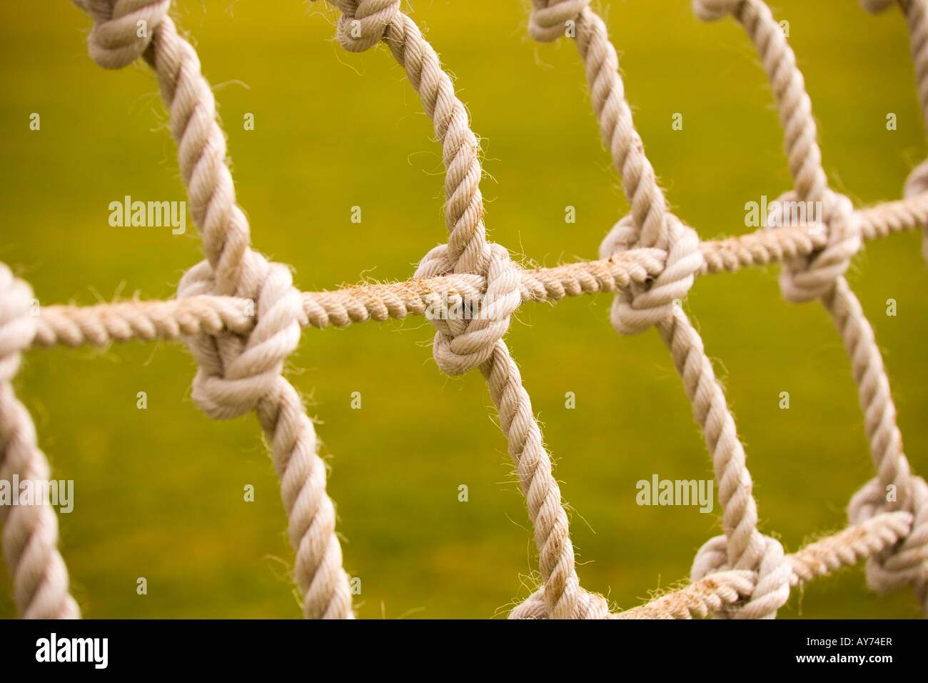 Army assault course, knotted rope net, with green grass background ...