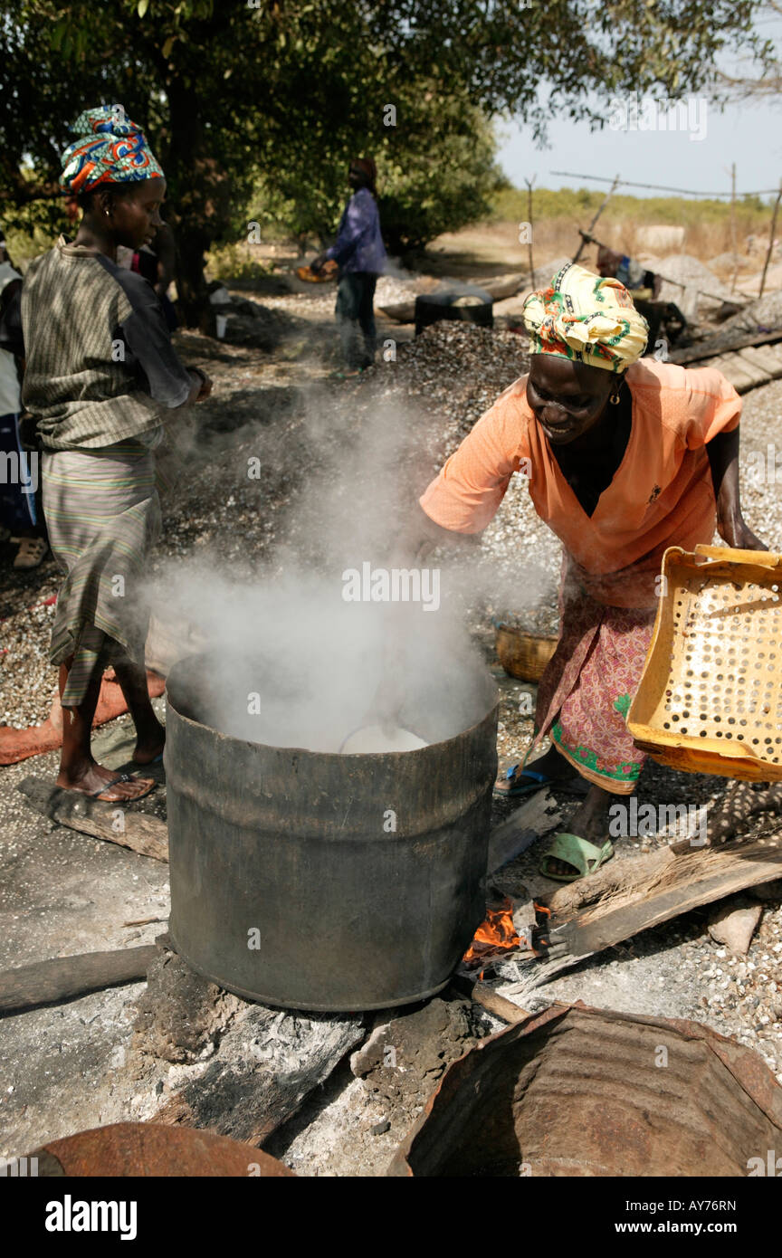 Working at the Bolong sorting washing and cooking shellfish The Gambia ...