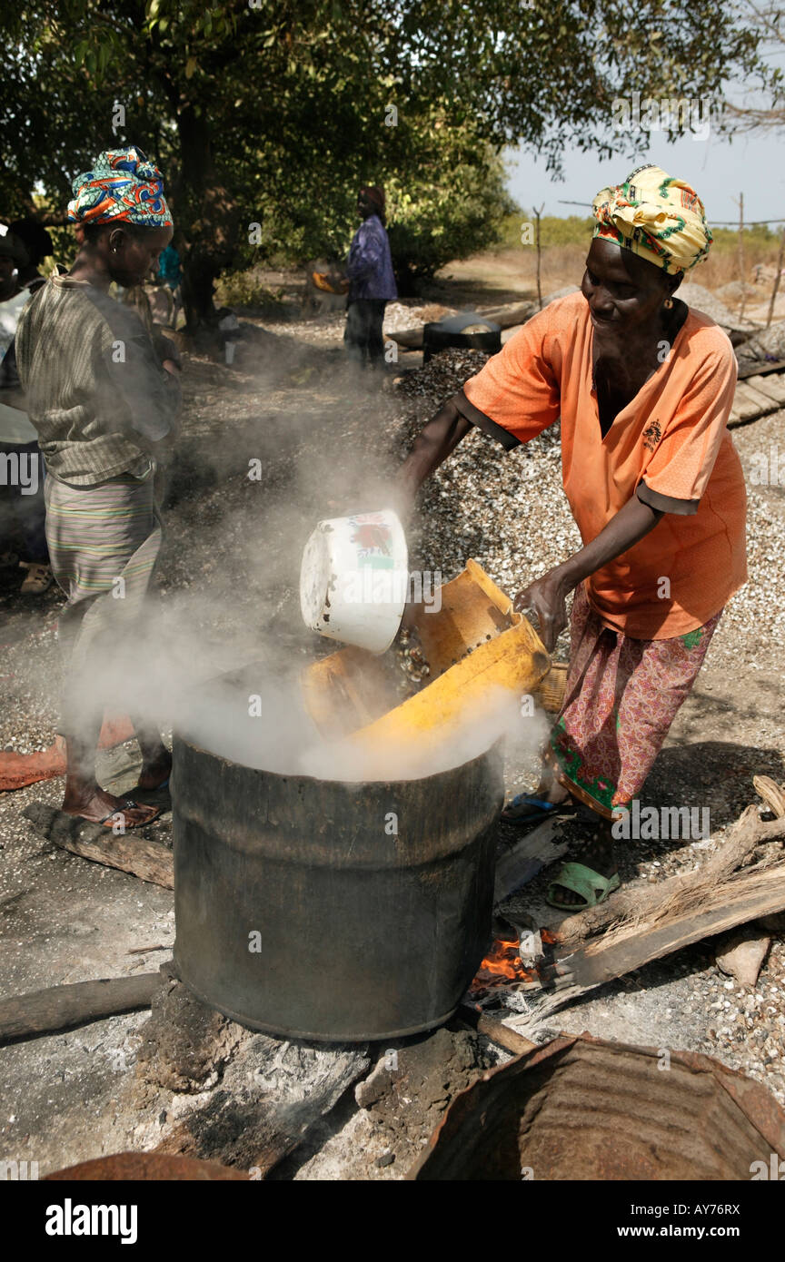 Working at the Bolong sorting washing and cooking shellfish The Gambia ...