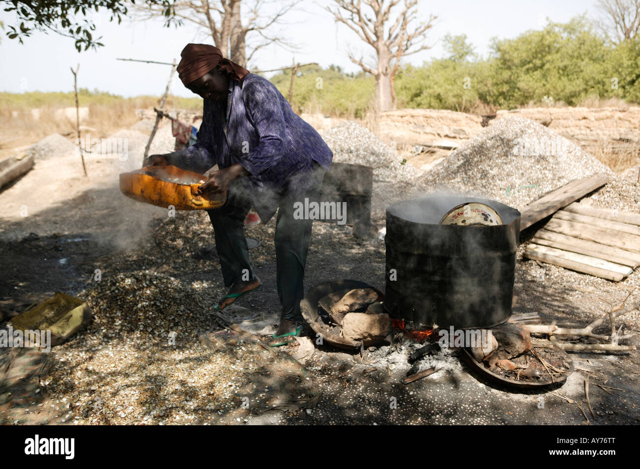 Working at the Bolong sorting washing and cooking shellfish The Gambia ...