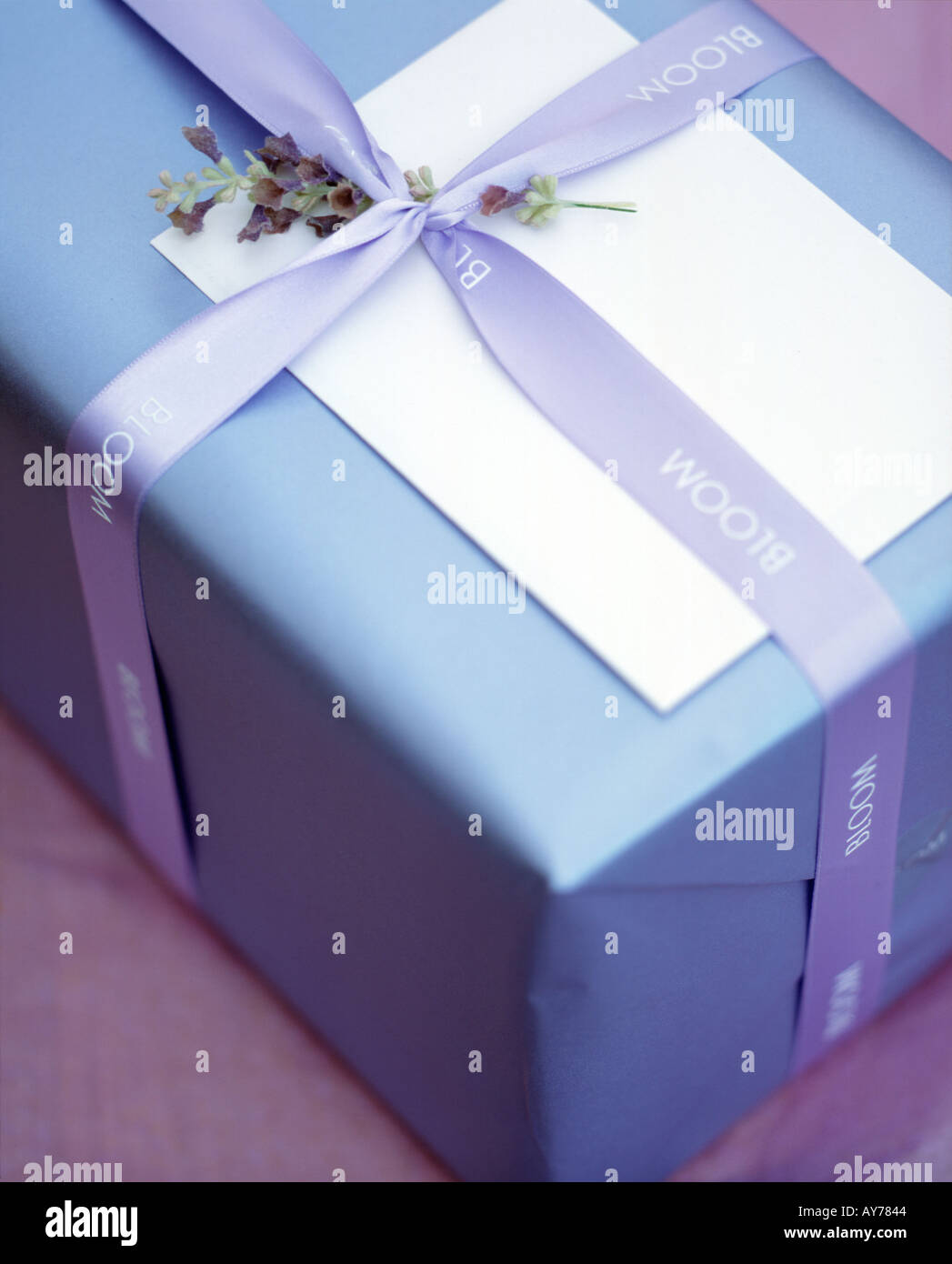 Letter with Gift wrapped in blue parcel Stock Photo - Alamy