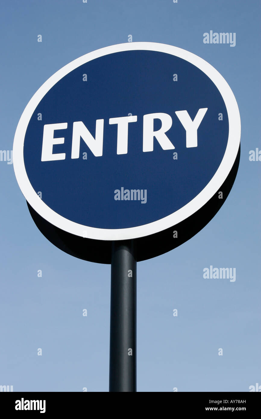 Entry sign against blue sky background Stock Photo - Alamy
