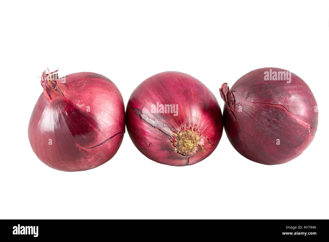 the three red onions isolated on white background Stock Photo - Alamy