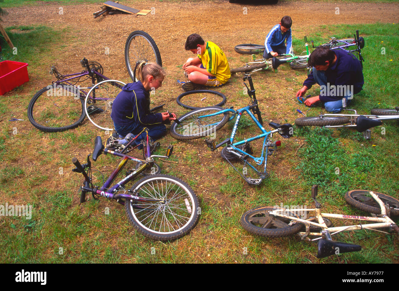 Children fixing their bikes Stock Photo - Alamy