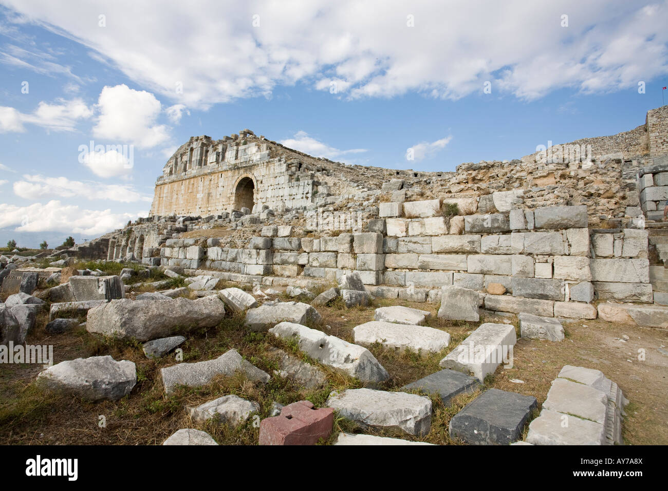 Tumbled Stadium Ruins Great blocks of stone backed by the ruins of a ...