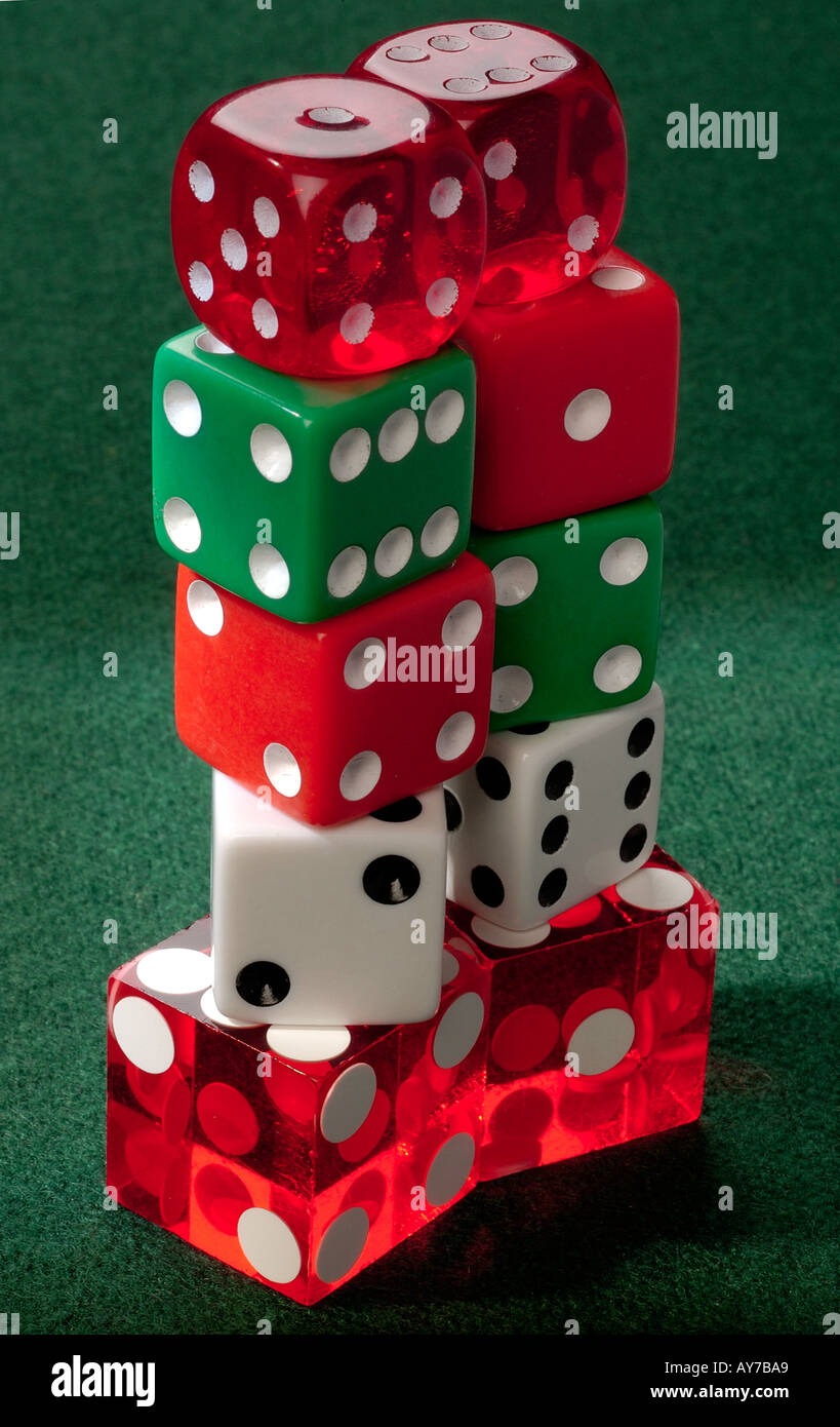 pile of different coloured dice on green baize Stock Photo - Alamy