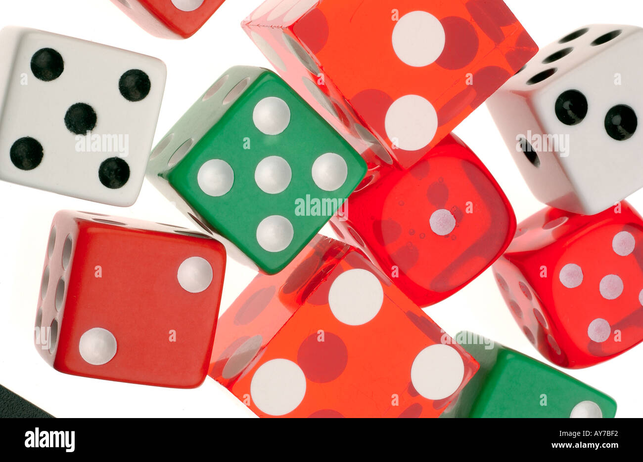 red green and white dice on white Stock Photo - Alamy