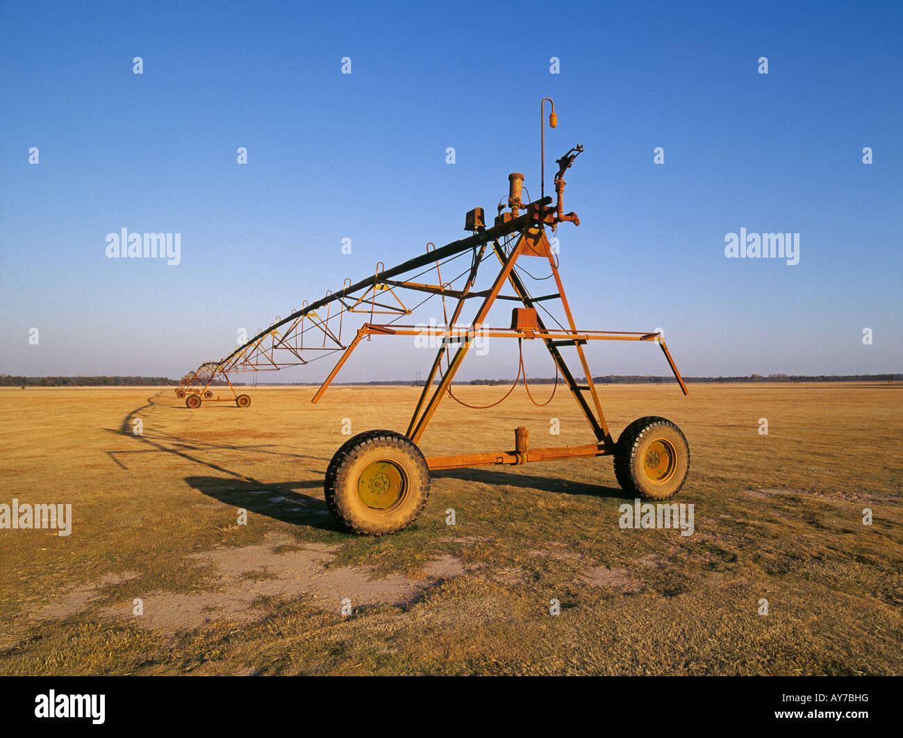 A large portable or movable irrigation system on a hay field in the ...