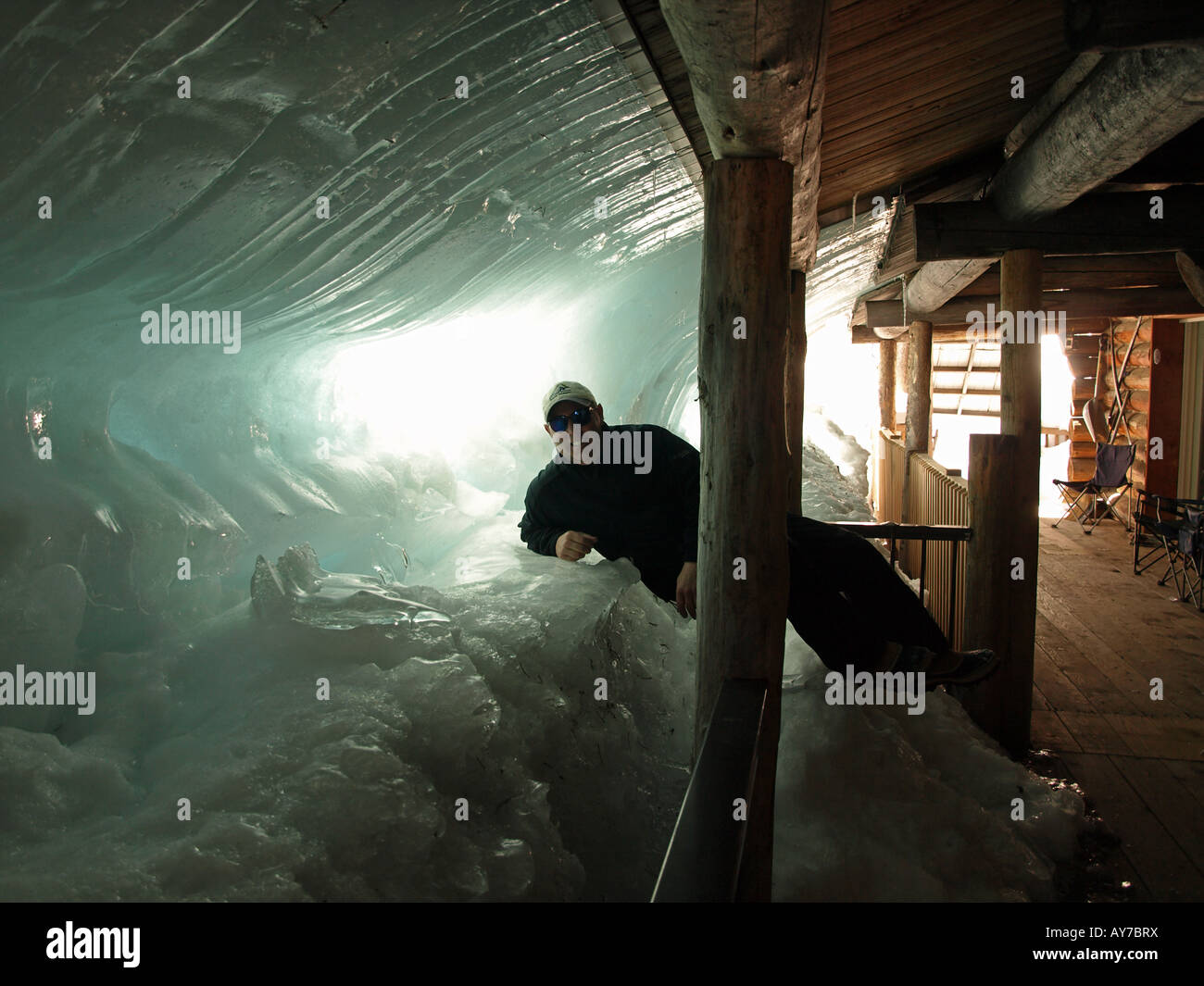 A sheet of ice from the roof Ice covers the deck area a two story cabin ...