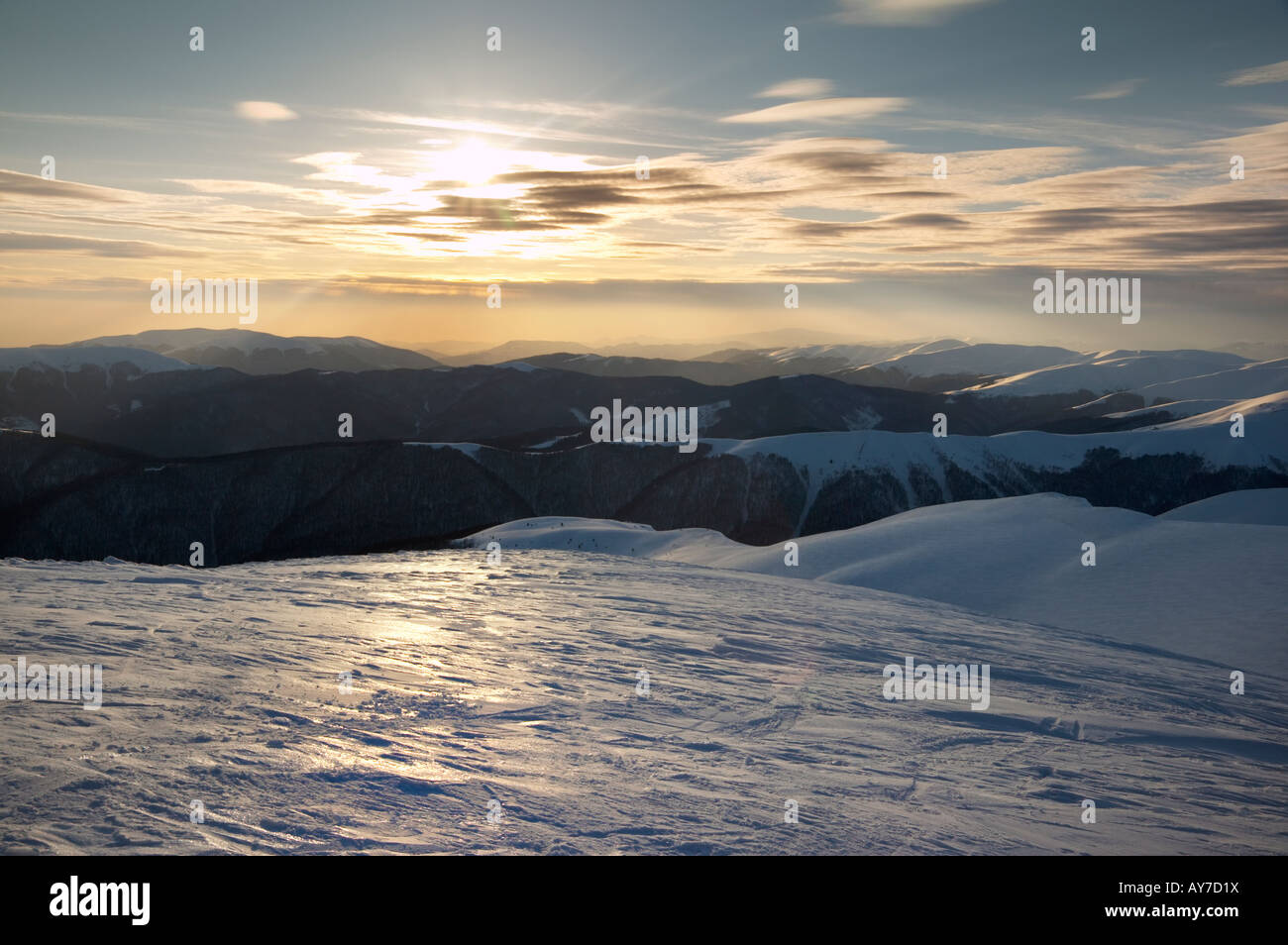 Beautiful mountain sunset landscape with sun way on ice coated ...