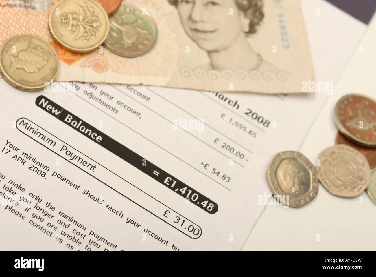 Credit card monthly statement bill baalnce and money coin cash showing ...